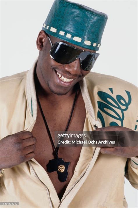Rapper Kool Moe Dee Opening His Shirt To Show His Africa Medallion