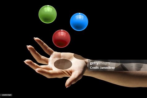 Multitasking Juggling Three Colorful Balls In One Hand High Res Stock