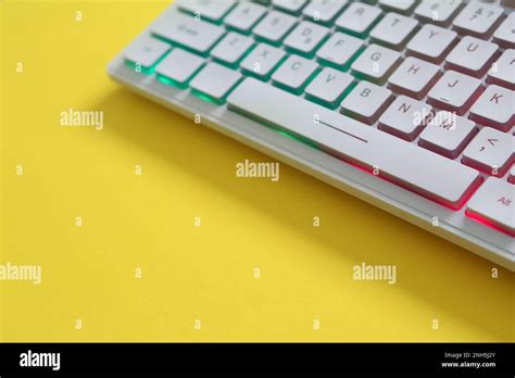 Modern Rgb Keyboard On Yellow Background Closeup Space For Text Stock