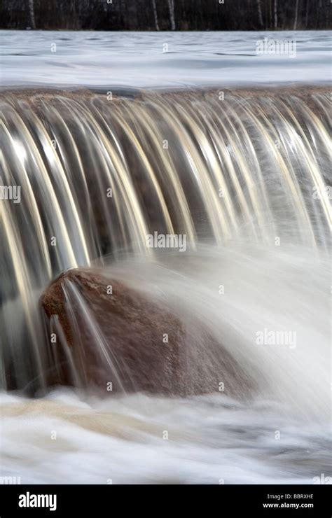 Water Flowing Over Submerged Dam Stock Photo Alamy