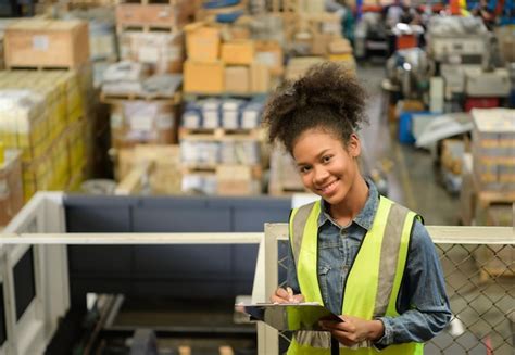 Premium Photo Female Warehouse Worker Counting Items In An Industrial Warehouse On The