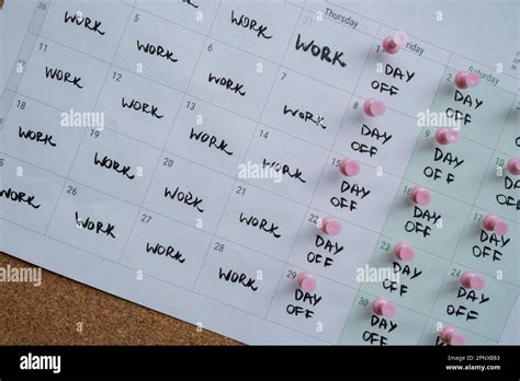 4 Day Work Week Printed Calendar With Pink Pins On Three Days Off In