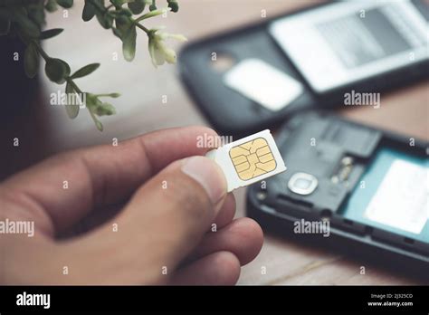 SIM Card For Smart Phone Changing The SIM Card Stock Photo Alamy