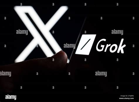 Grok Ai Chatbot Logo Seen On Smartphone Screen And Finger Pointing At It Grok Is A New Chat Bot