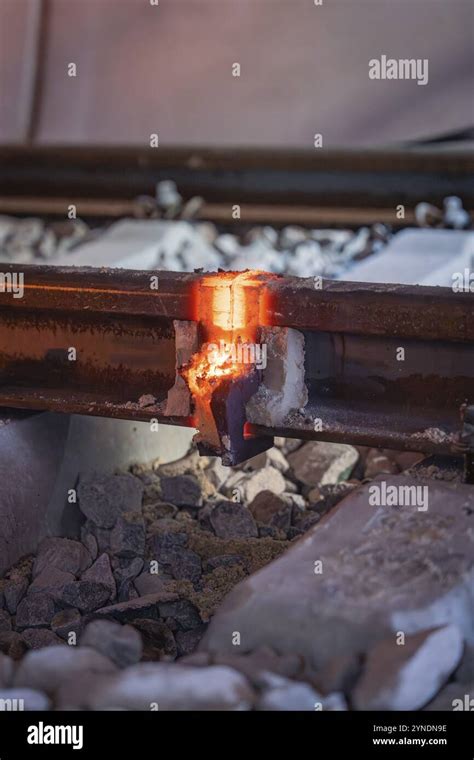Welding Work On A Rail Interface With Molten Metal And Glowing Heat