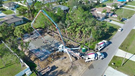 Construction Of Concrete Foundation Slab At New House Developing Site Workers Pouring Concrete