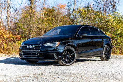 Black 2015 Model Audi A3 Under Sunlight Surround Surrounded Woods