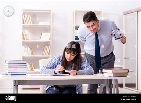 Male Lecturer Giving Lecture To Female Babe Stock Photo Alamy