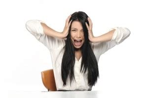 A Frustrated And Angry Woman Is Screaming Out Loud And Pulling Her Hair