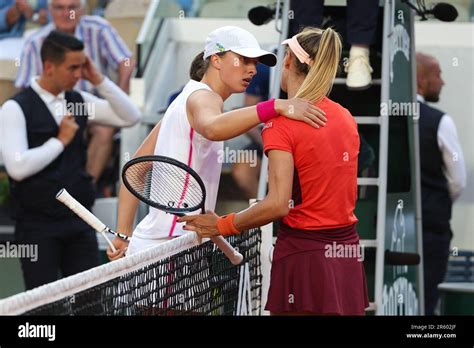 Iga Swiatek Of Poland Hugs Lesia Tsurenko Of Ukraine Who Retires Due To