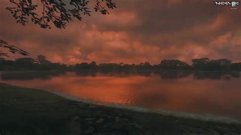 Живые обои Закат на берегу озера скачать на