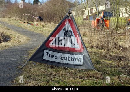 Tree Cutting Men At Work Warning Signs In The Woods For Walkers Stock Photo Alamy