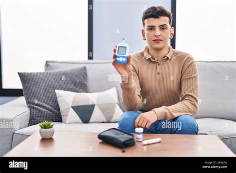 Non Binary Person Using Blood Pressure Monitor Thinking Attitude And