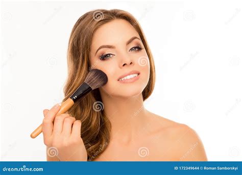 Beautiful Woman Applying Foundation Powder With Makeup Brush Stock