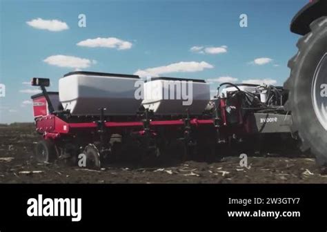 Tractor With Special Precision Planters Seeder Is Working In The Field