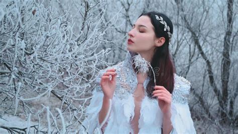 Fantasy Woman Snow Queen Holding Freezing Ice Branch Girl Enjoys
