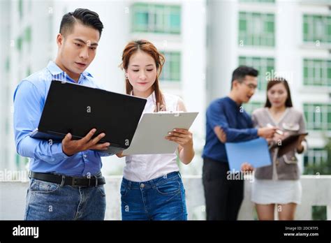 Developers Discussing Programming Code Stock Photo Alamy