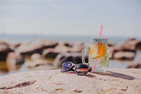 Free Photo Sunglasses With Refreshing Drink