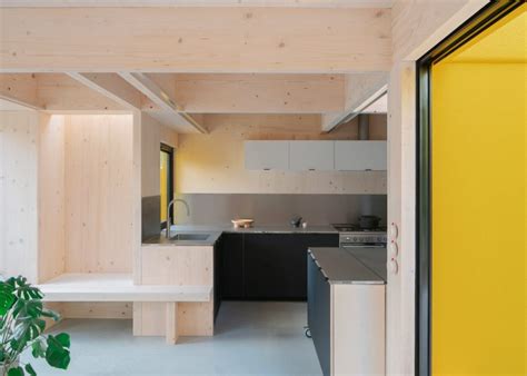 Unknown Works Finishes CLT House Extension With Bright Yellow Render