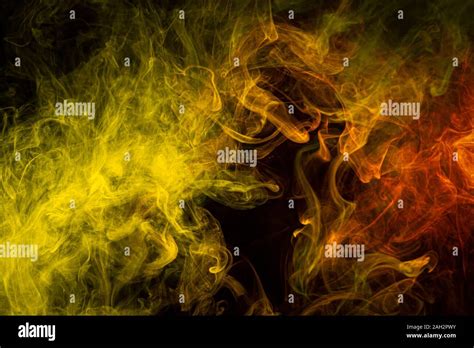 Pattern Neon Yellow And Orange Smoke In The On A Dark Isolated