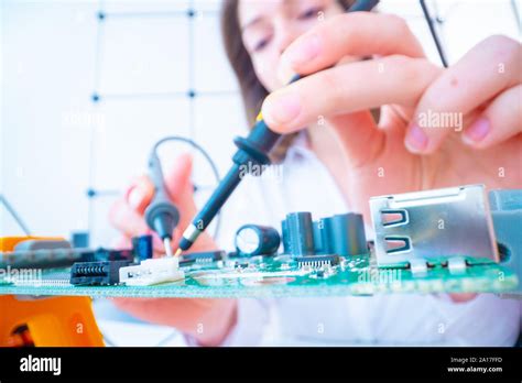 Girl With Measuring Devices In The Electronics Laboratory Stock Photo Alamy