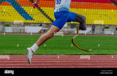 Athlete Runner Sprinter On Prosthesis Running Stadium Track Disabled