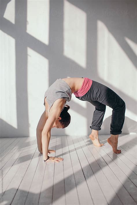 Flexible Woman In Yoga Pose By Stocksy Contributor Serge Filimonov