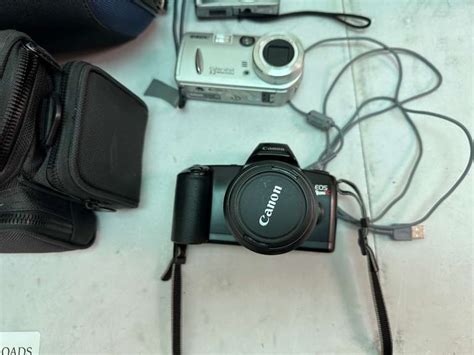 1 Canon Eos Rebel Digital Camera And Assorted Digital Cameras Gavel