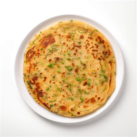 Premium Ai Image Aloo Paratha Pakistani Dish On Plate On White Background Directly Above View