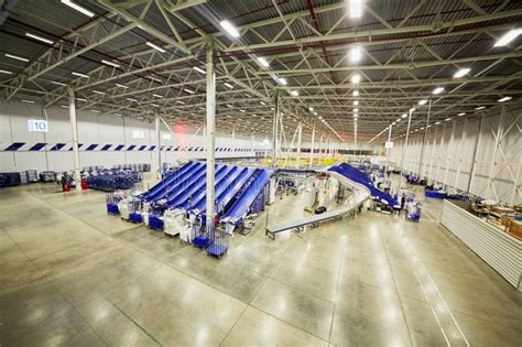 Workers In Automated Sorting Center At Post Editorial Stock Image