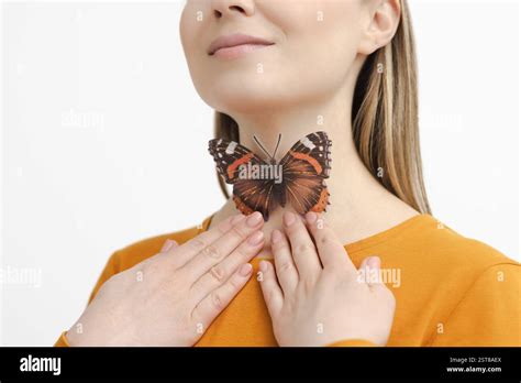 Woman With A Butterfly On Her Neck Symbolizing An Enlarged Thyroid