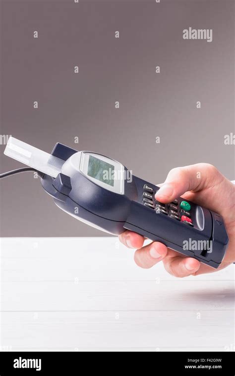 Man Entering His Pin On Terminal Stock Photo Alamy