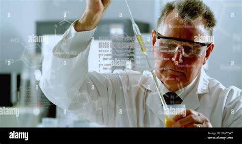 Image Of Data Processing And Chemical Formula Over Caucasian Male Scientist Taking Sample Stock