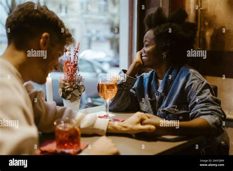 Boyfriend Holding Hand And Flirting With Girlfriend During Date At