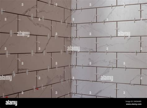 Newly Applied Rectangular Wall Tiles In A Shower Cubicle With The