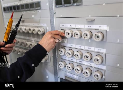 Hand Of Female Technician Operating Electrical Fuse Box Stock Photo Alamy