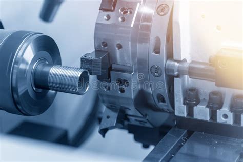 The CNC Lathe Machine Cutting The Thread At The End Of The Pipe Stock Photo Image Of Drill