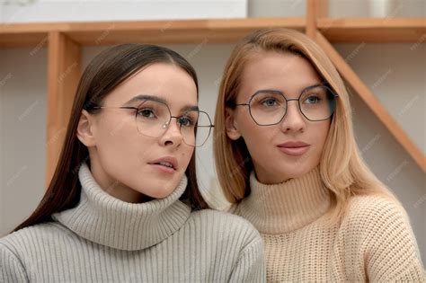 Premium Photo Two Beautiful Fashion Girls In Glasses And Modern