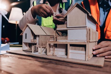 Engineers Are Helping To Design Work On Blueprints And Collaborate On Structural Analyzing Of