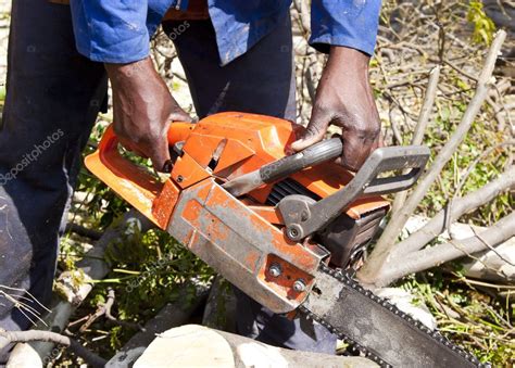Man Cutting Tree With Chain Saw Stock Photo AOosthuizen 5413918