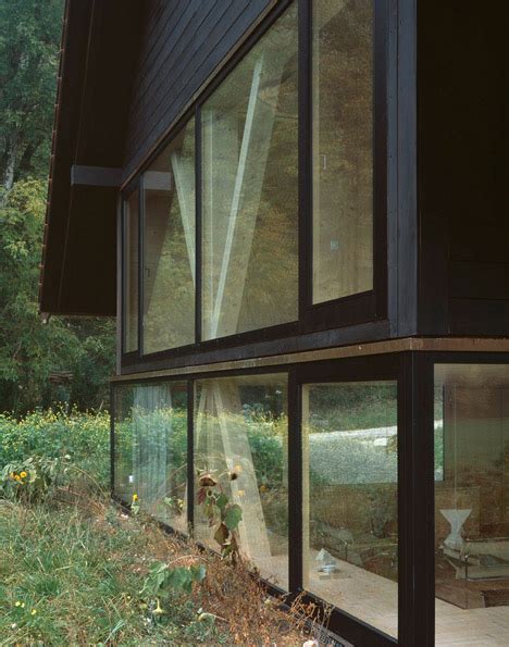 Swiss House By Pascal Flammer With Wooden Braces And A Circular Window