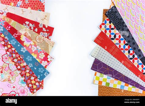 Symmetrical Stack Of Spread Out Furoshiki Fabrics Adorned With A Large