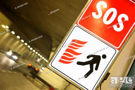Illuminated Emergency Exit Sign In A Motorway Tunnel Guiding You To An Escape Tunnel Stock