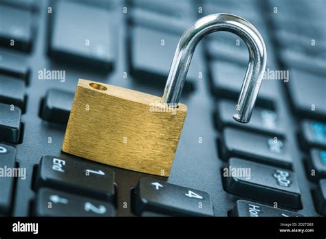 Computer Security Concept Unlocked Padlock On Laptop Keyboard Open