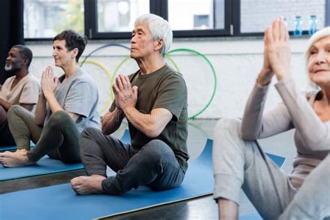 Barefoot Asian Man Practicing Yoga On Stock Image Image Of Wellbeing