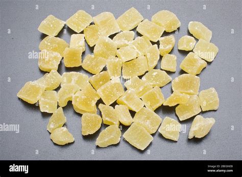 Dried Pineapples Cubes With Sugar Isolated On The Gray Background Stock