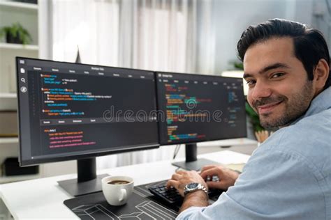 Smiling It Working Software Development Looking Camera On Two Pc Surmise Stock Photo Image
