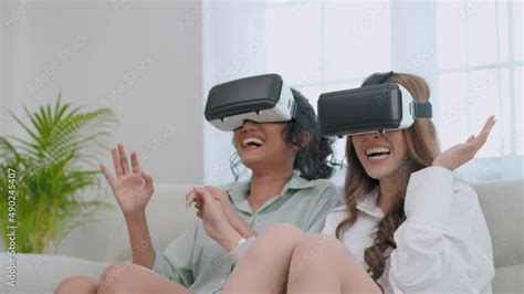 Lgbtq Asian Couples Or Lesbians Or Friends Are Playing Games And Wearing Virtual Reality Glasses