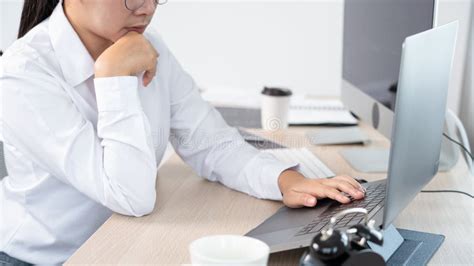 Young Asian Woman Programmer Typing Code Working With Computer At Table Coding Cyberspace And
