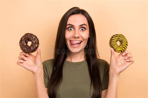 Photo Of Tricky Excited Lady Wear Khaki T Shirt Licking Lips Ready Eat Chocolate Doughnuts